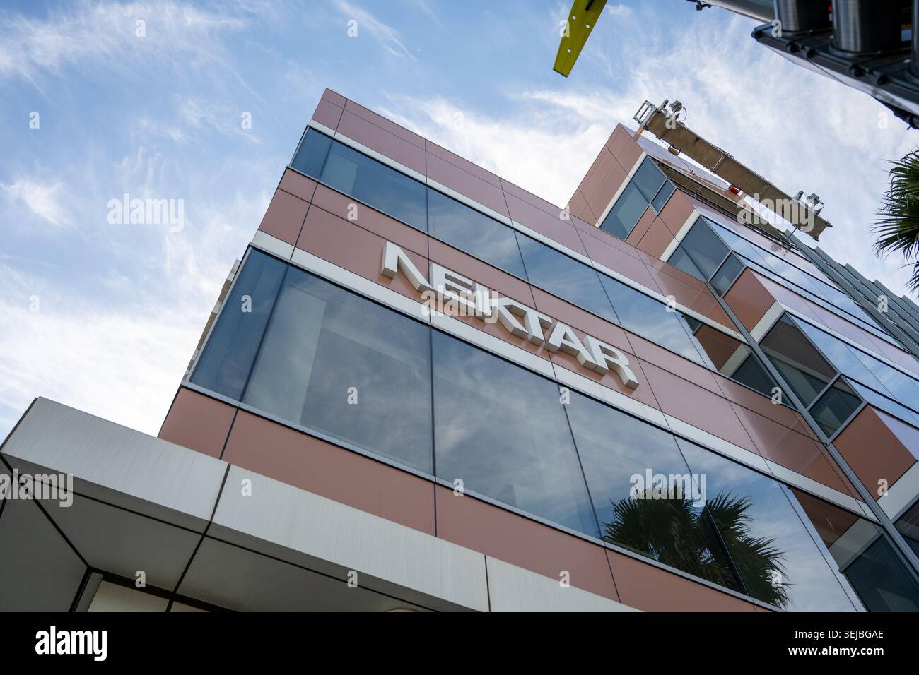 Low angle view of Nektar branded glass and metal office building ...