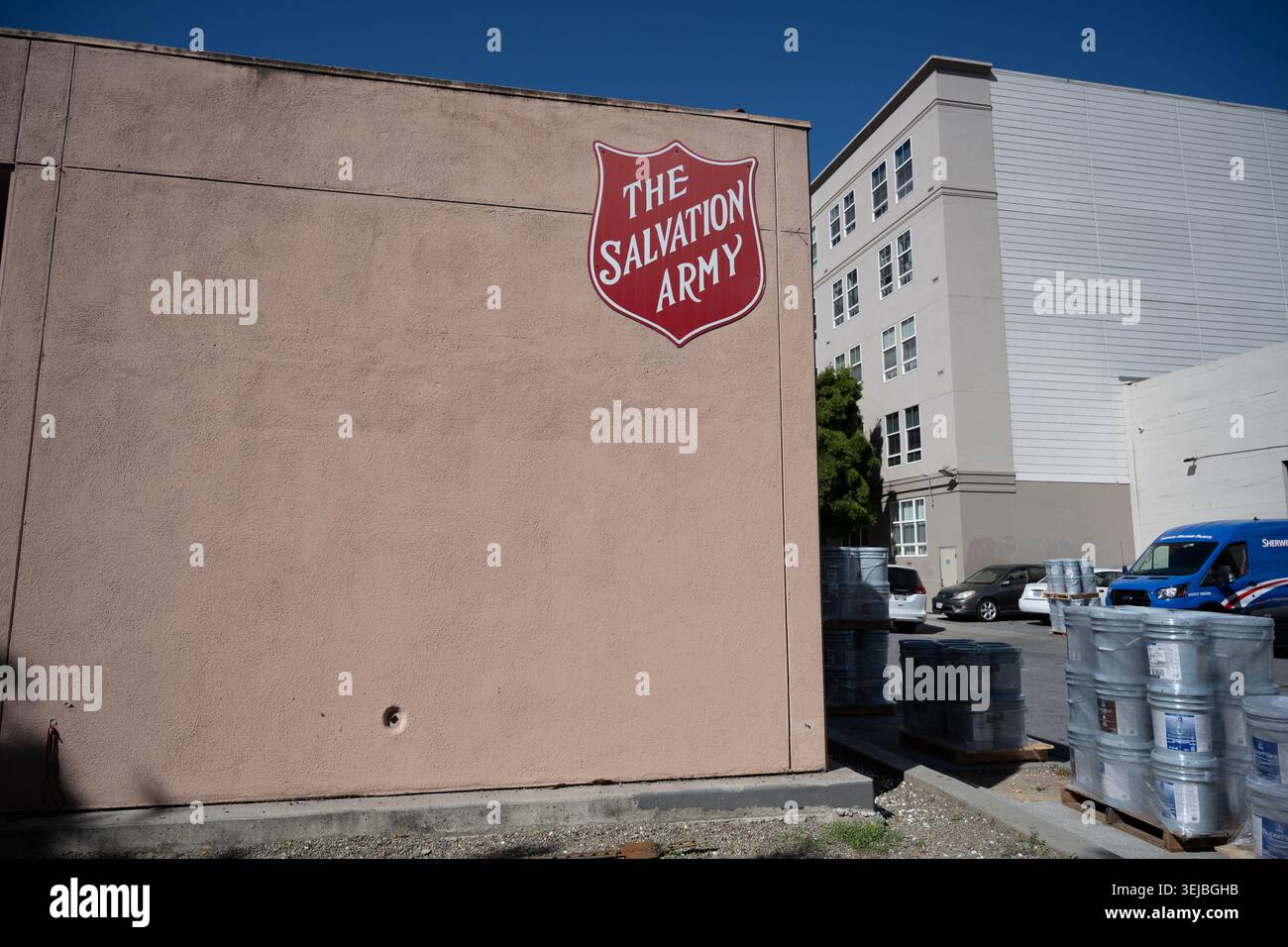 Side view of The Salvation Army building with red shield logo and ...