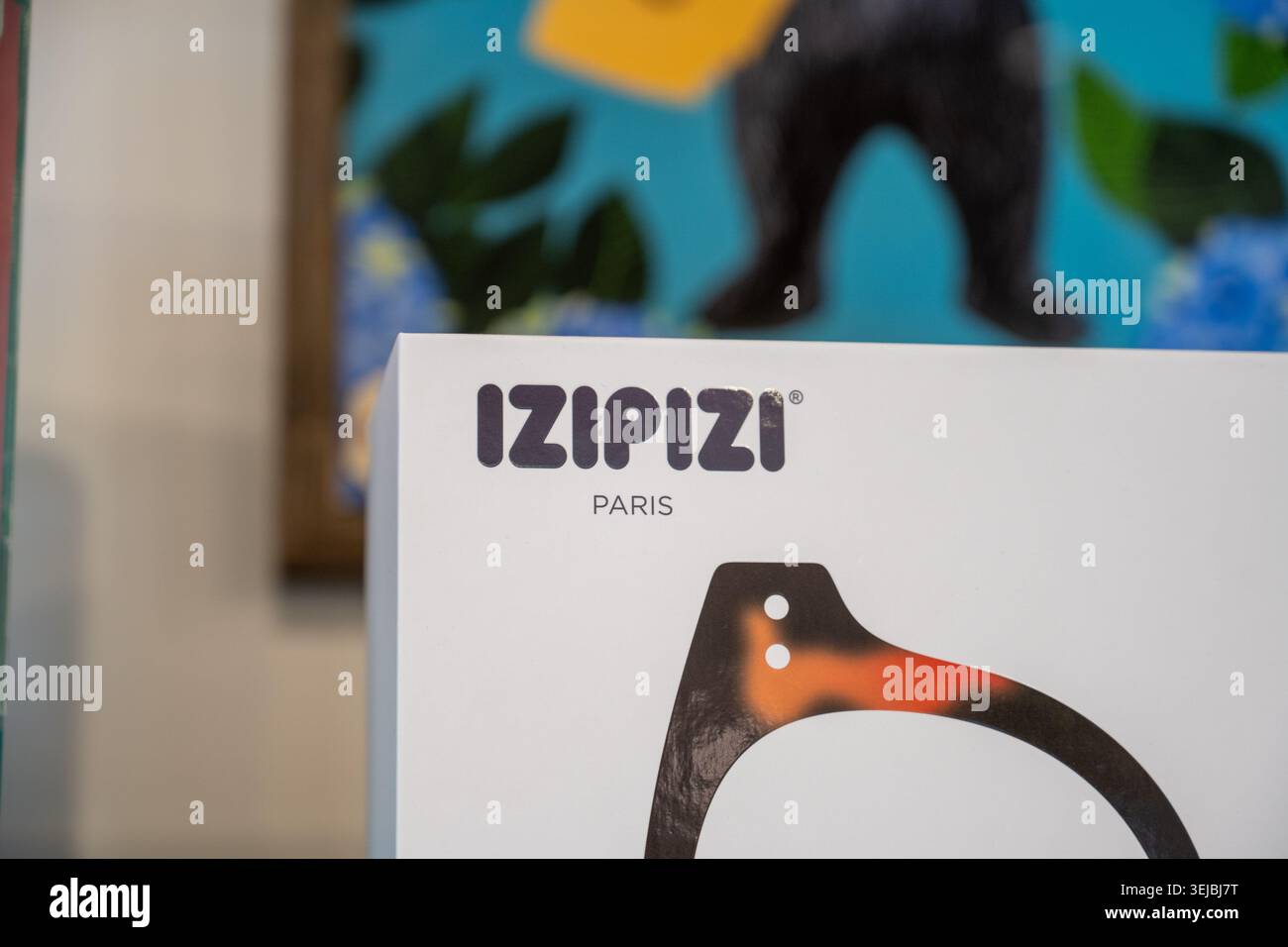 Close-up of IZIPIZI Paris eyewear packaging box with colorful artwork ...
