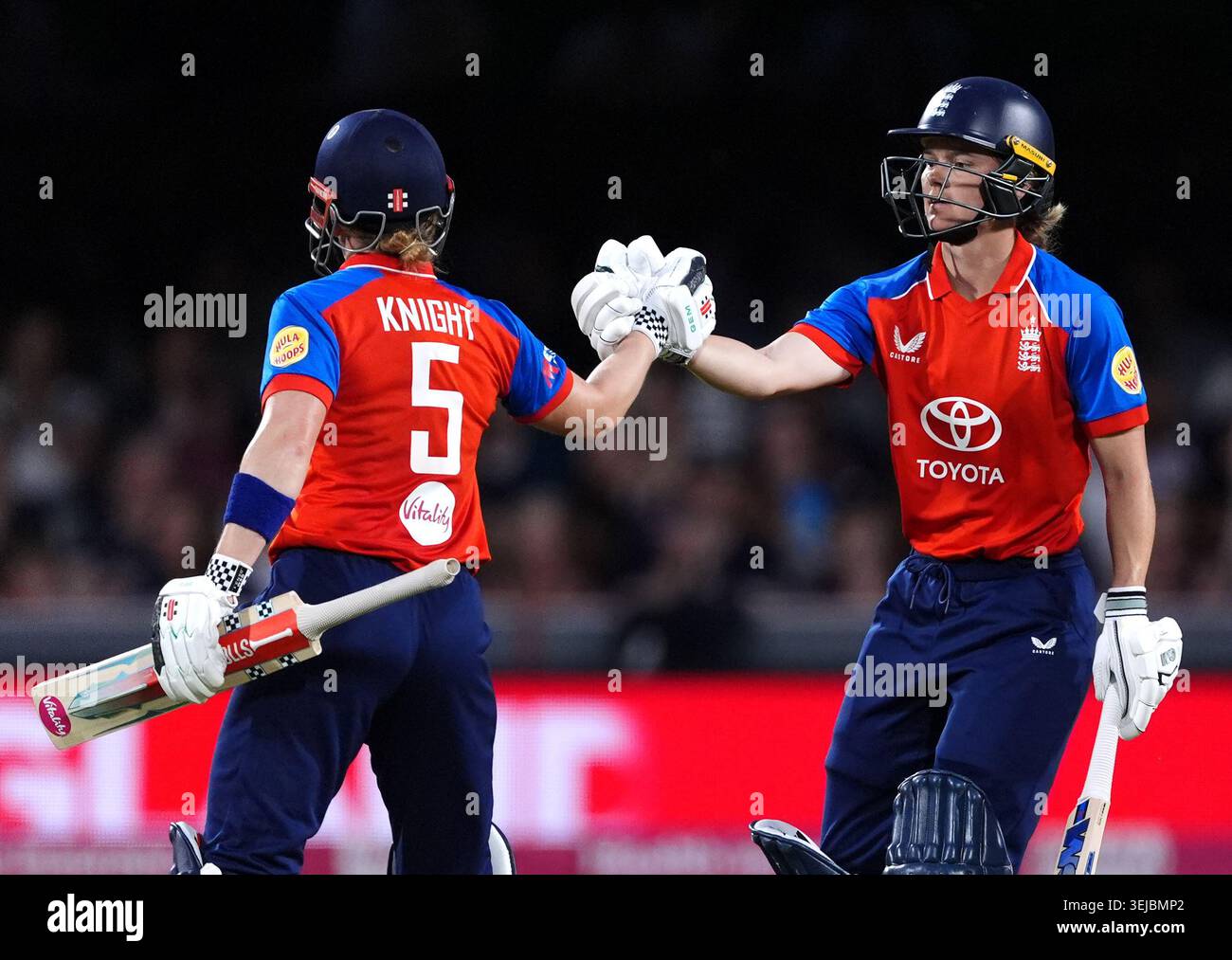 England's Amy Jones (right) celebrates making 50 runs with batting ...