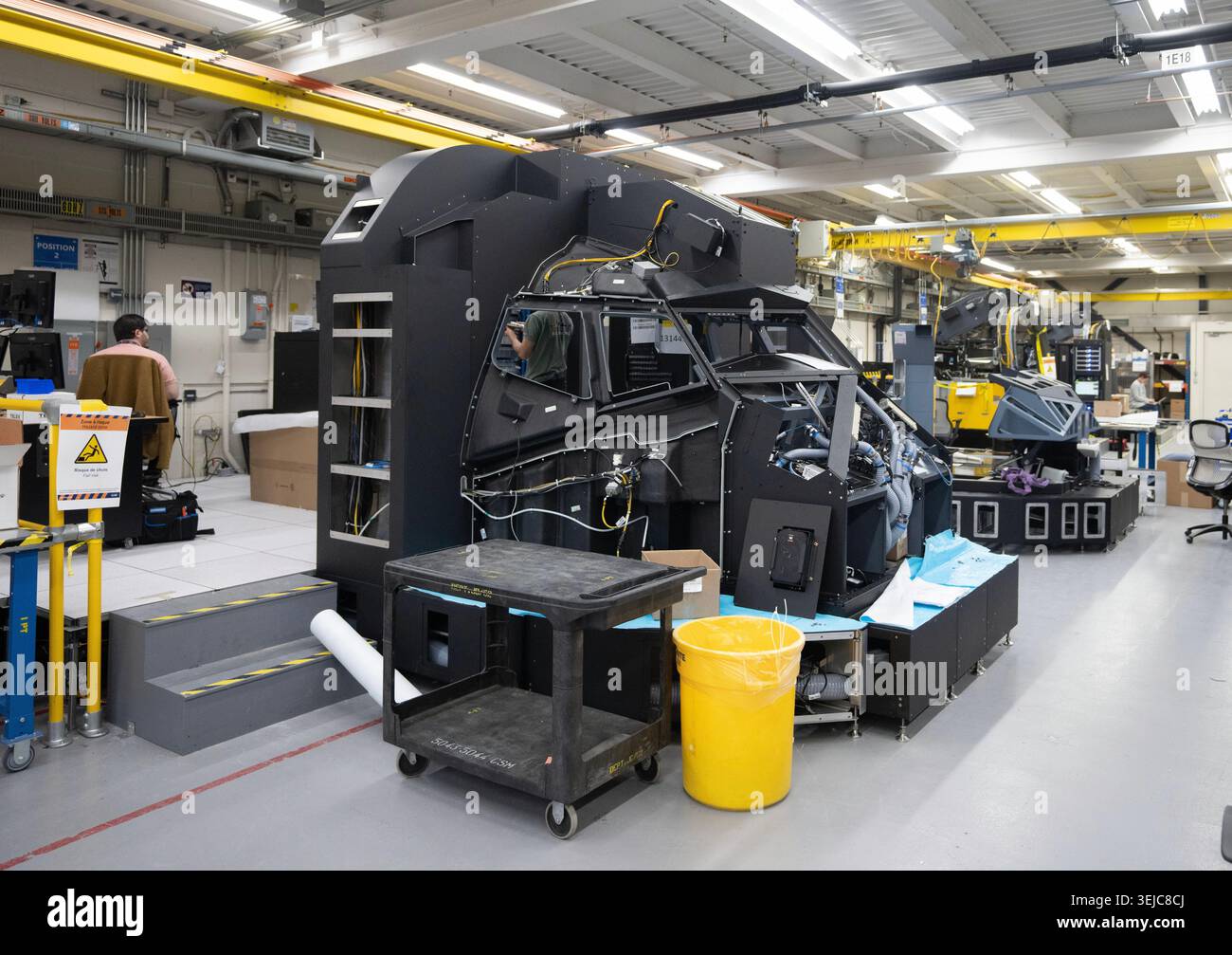 The flight simulator assembly plant is seen at the CAE facility in ...