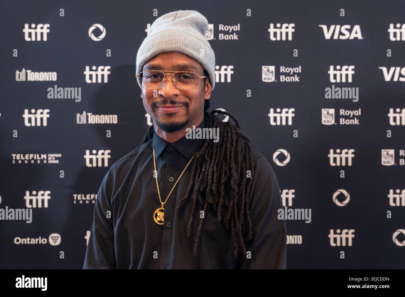 Director R.T. Thorne poses for a photo at a TIFF press conference and ...