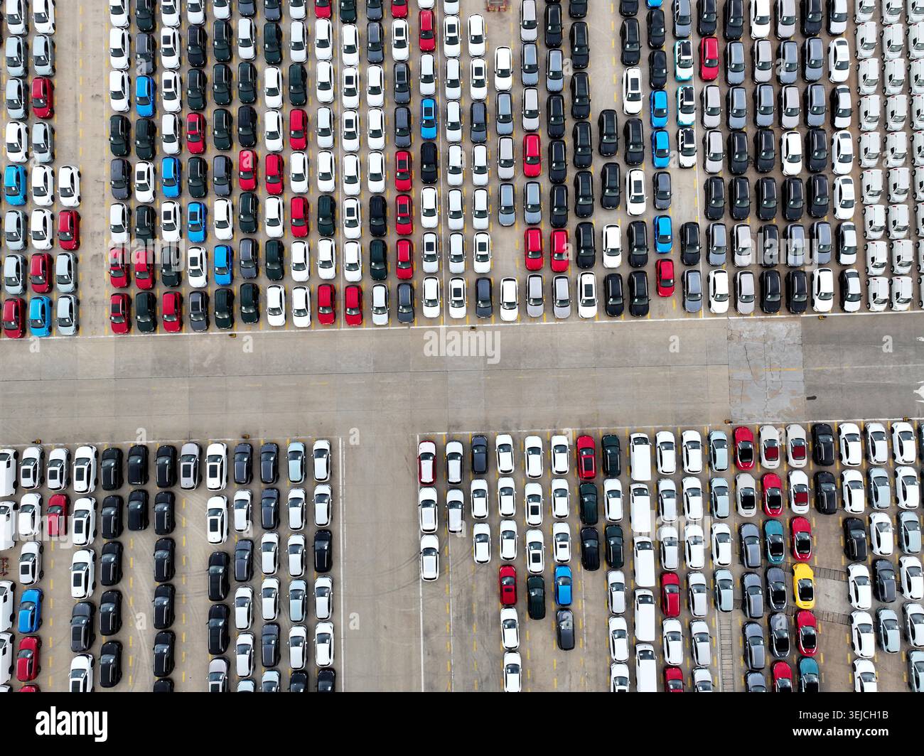 Workers prepare a batch of domestically produced cars for export at the ...