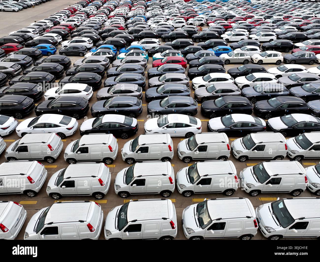 Workers prepare a batch of domestically produced cars for export at the ...