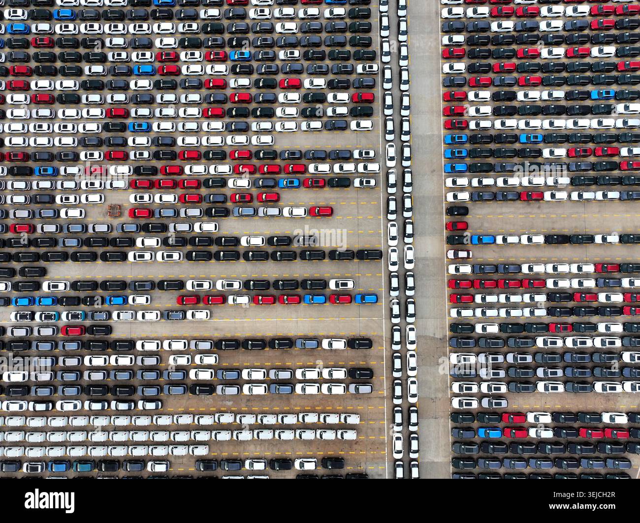 Workers prepare a batch of domestically produced cars for export at the ...