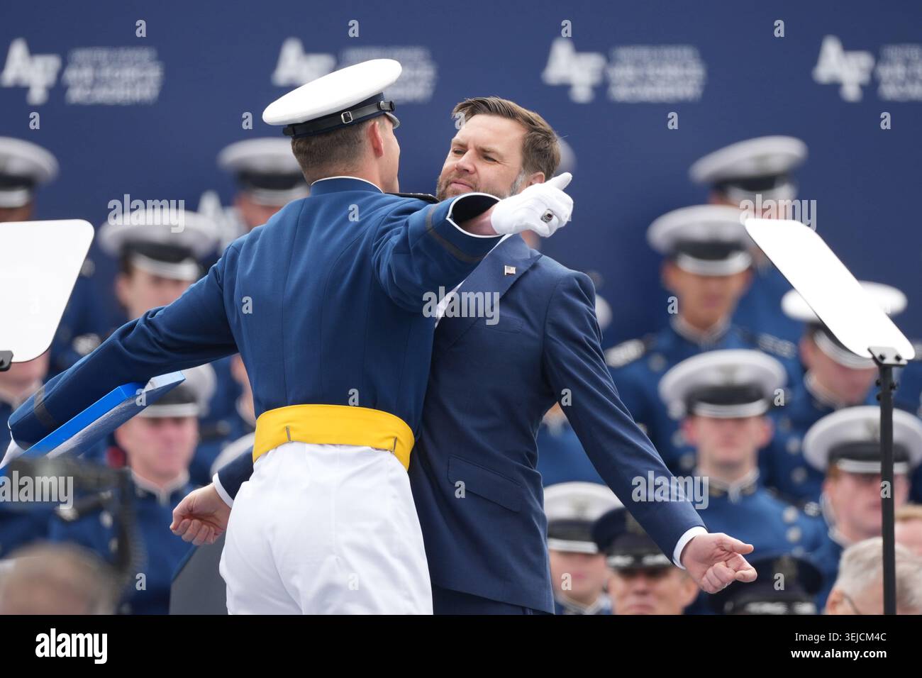 Vice President JD Vance bumps chests with a cadet during the graduation ...