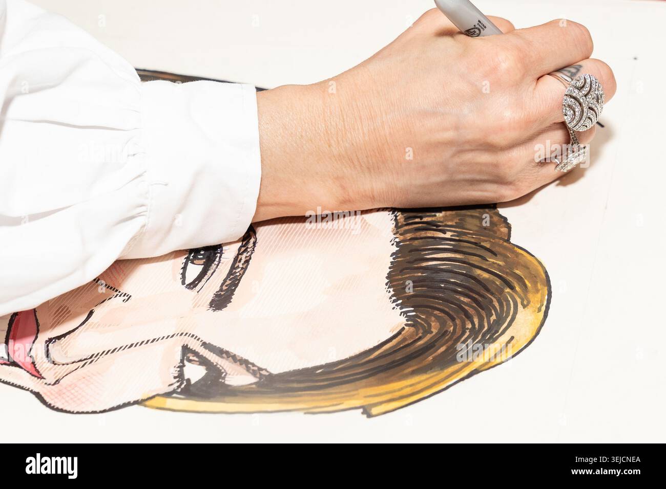 Shoshana Bean signs caricature of her as she is honored with a portrait ...