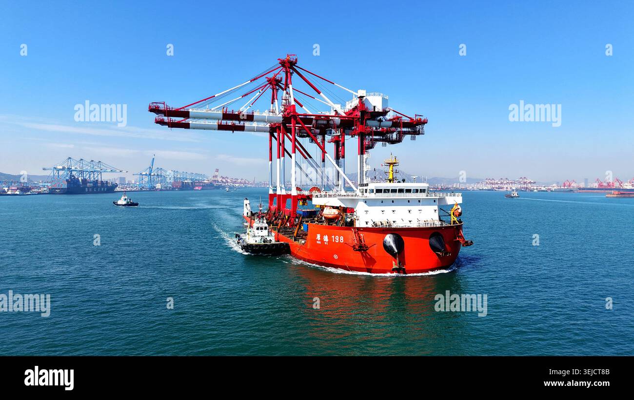 QINGDAO, CHINA - MAY 29, 2026 - A cargo ship loaded with cranes sailed ...