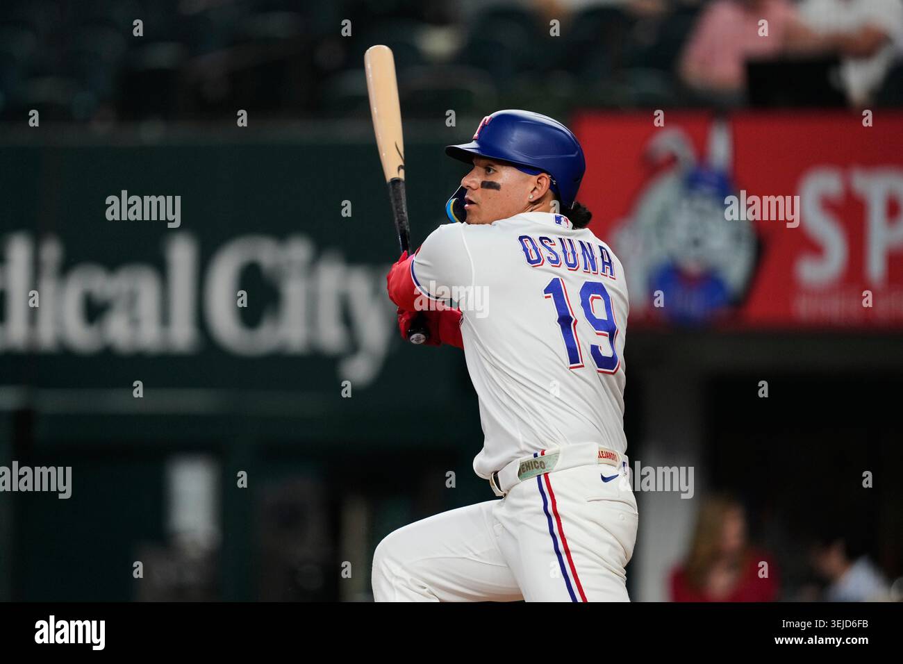 Texas Rangers' Alejandro Osuna follows through on a swing during a ...