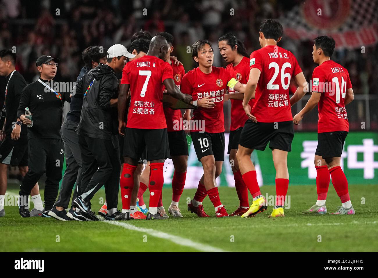 Takahiro Kunimoto celebrates with teammates after scoring during the ...