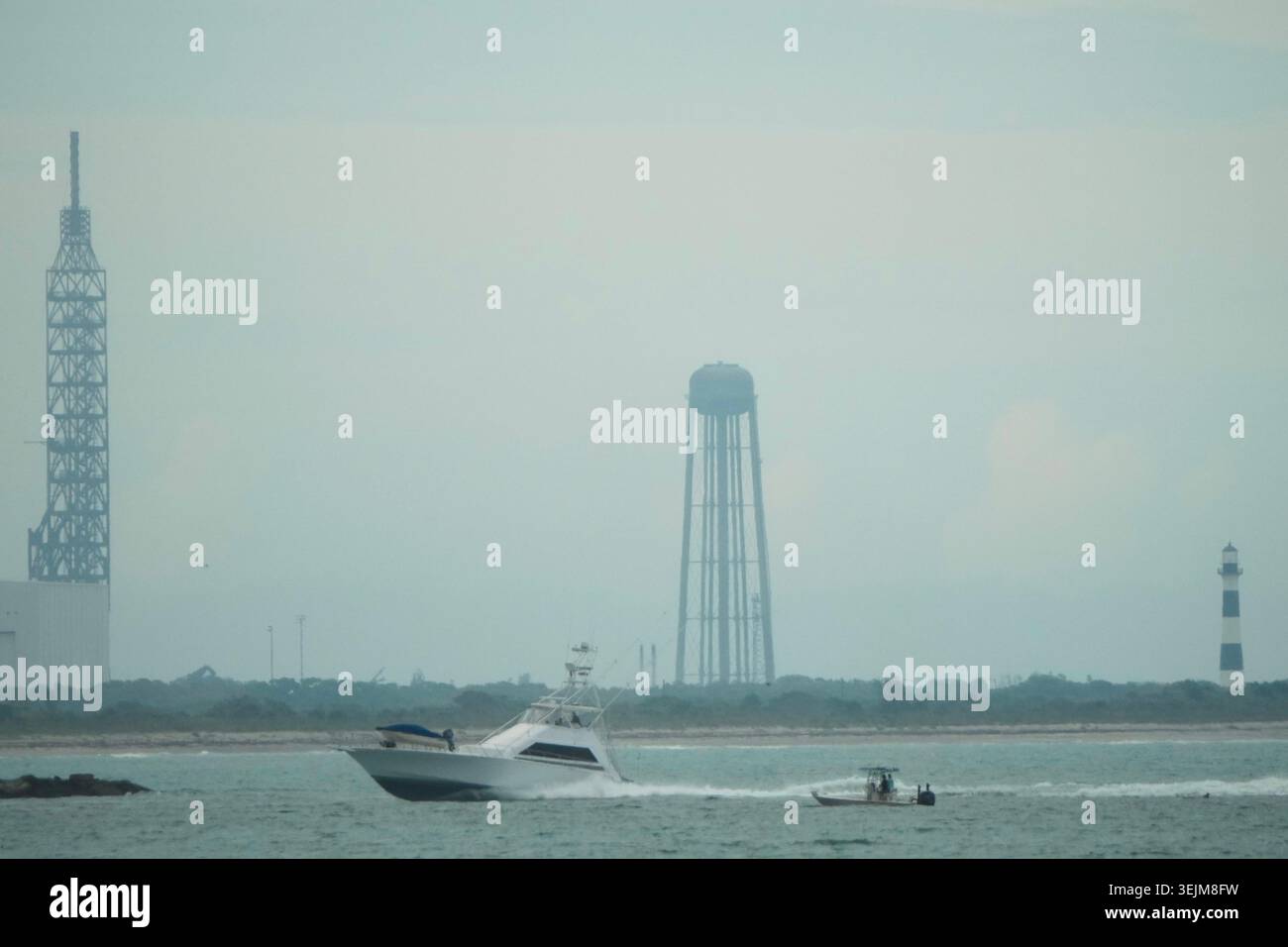 A lightning arrestor and a charred water tower are seen at pad 36 in ...
