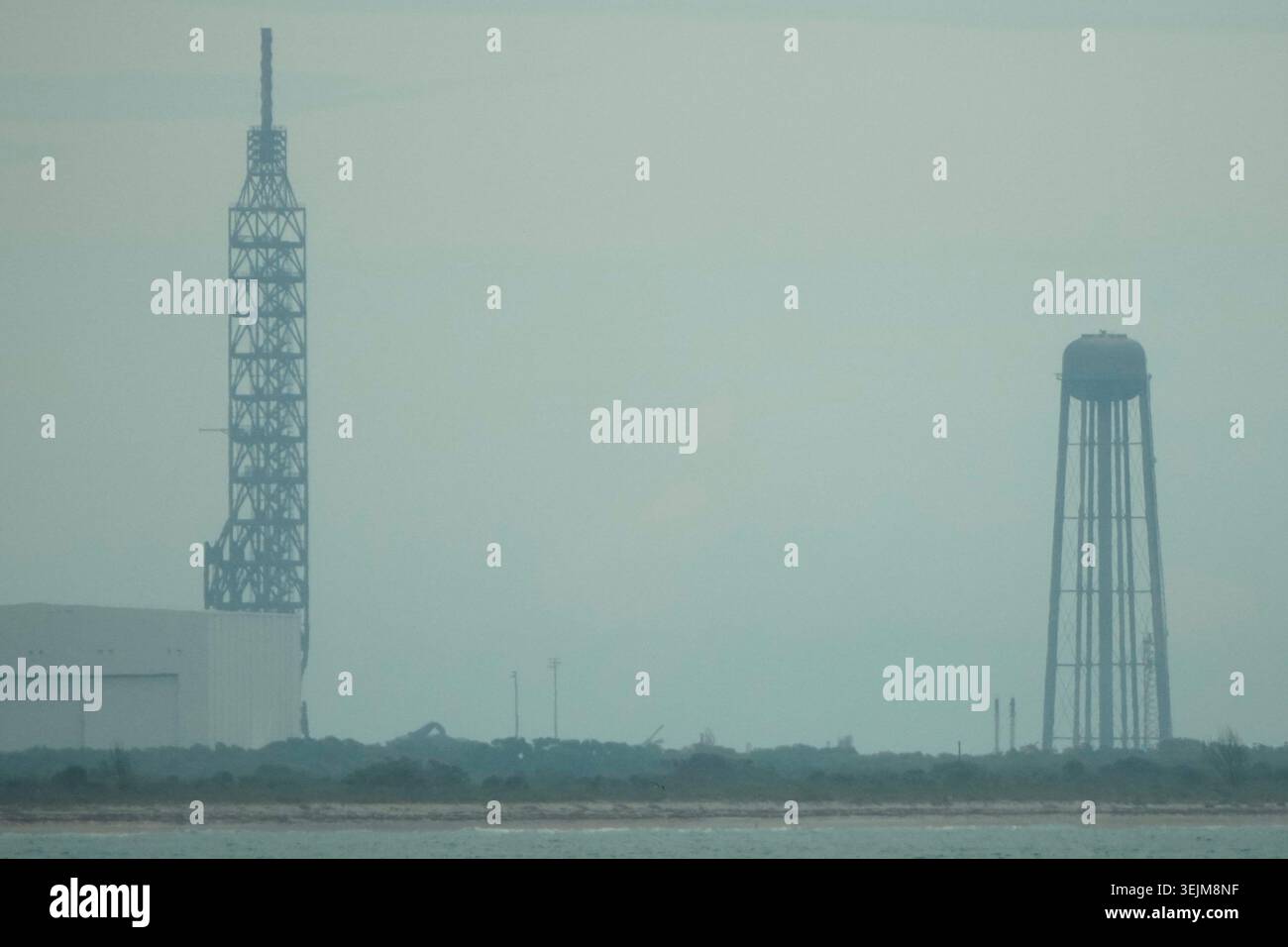 A lightning arrester and a charred water tower are seen at pad 36 in ...