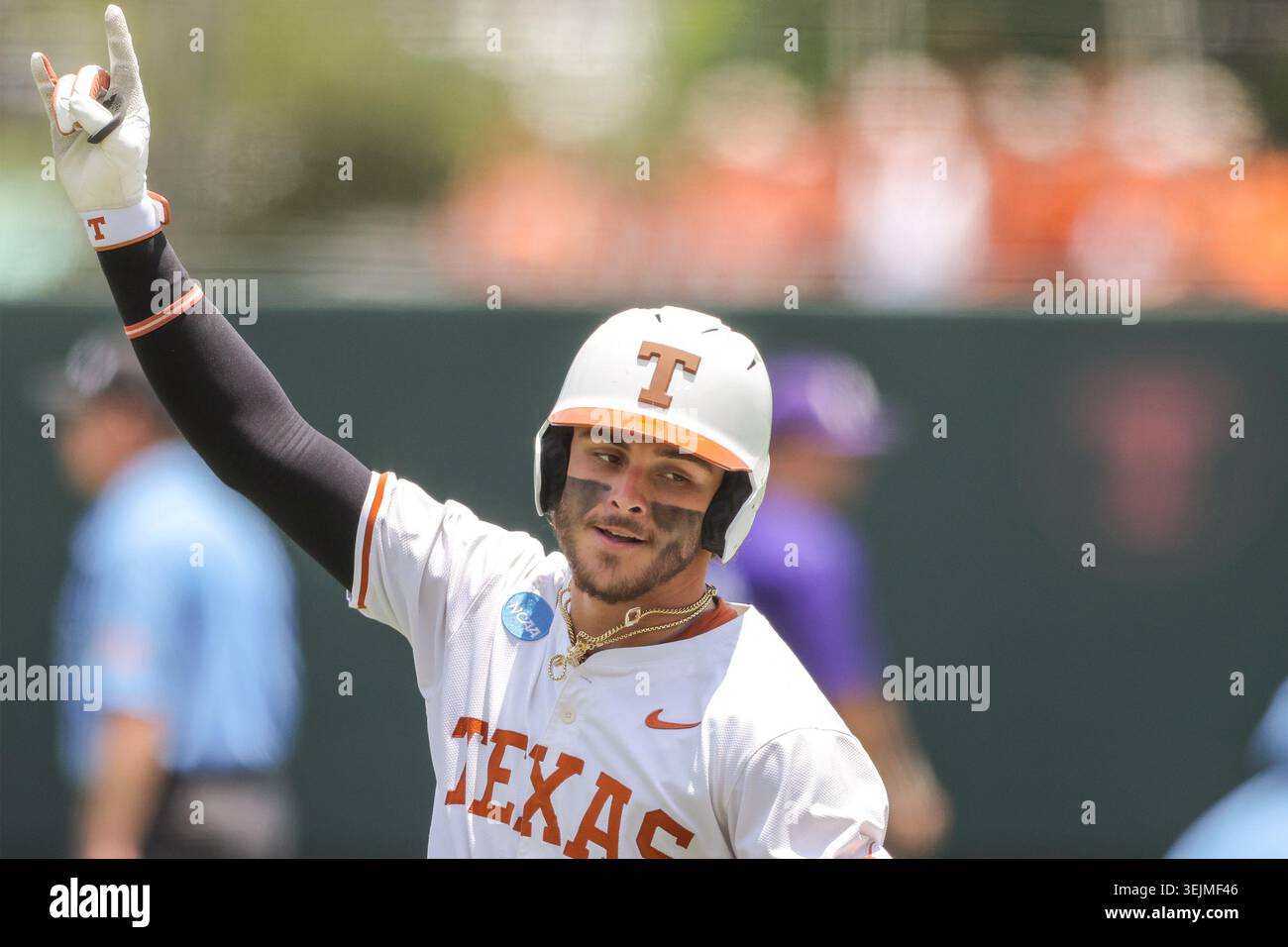 Texas right fielder Aiden Robbins (43) celebrates scoring against Holy ...