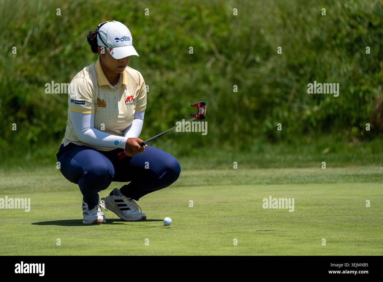 Arpichaya Yubol lines up her put on the 9th hole during the first round ...