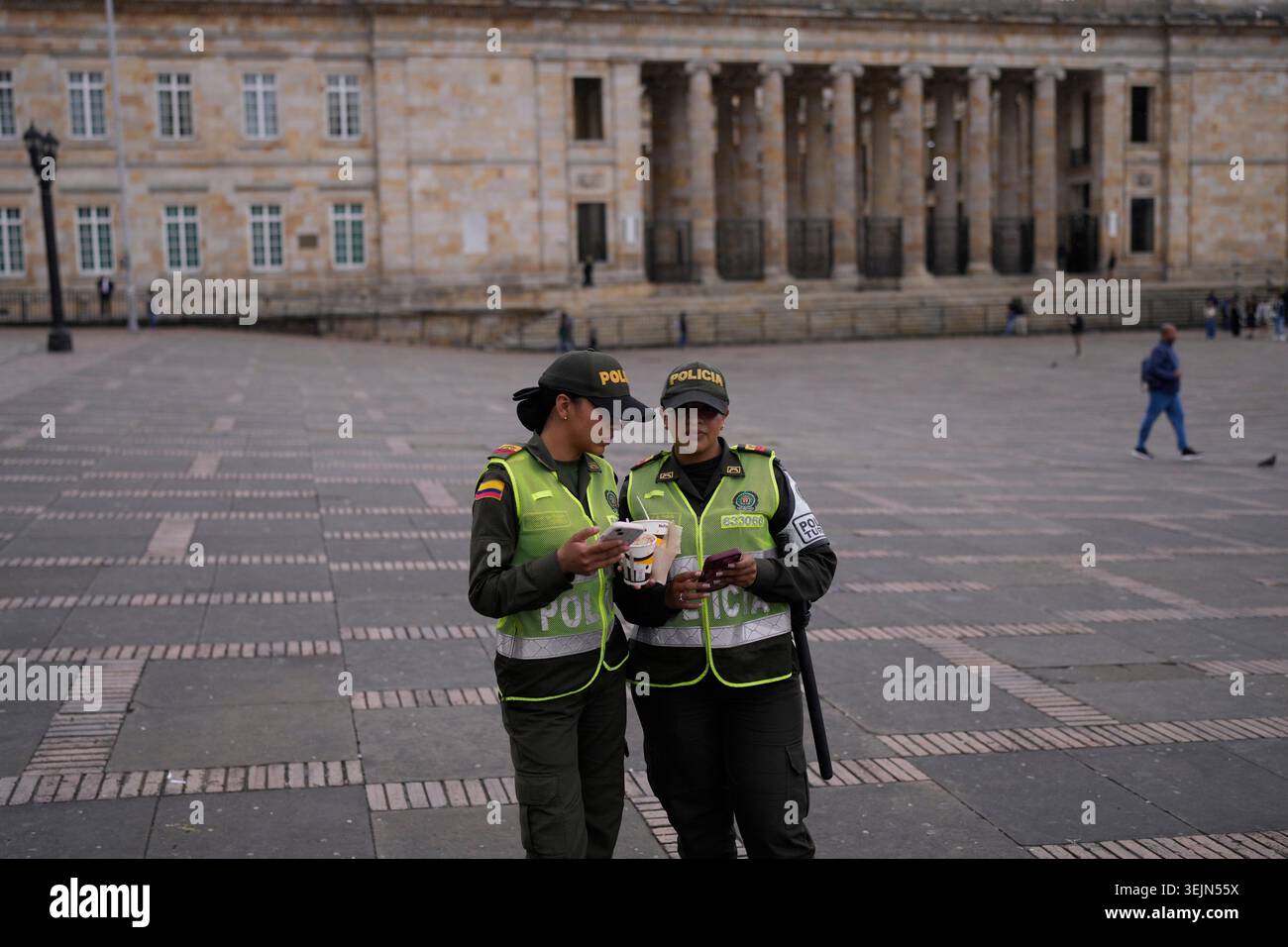 Police officers eat ice cream while patrolling Bolivar Square ahead of ...