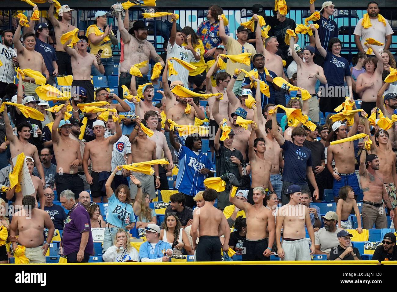 Fans in the "Tarp Off" section of the stadium wave shirts during the ...