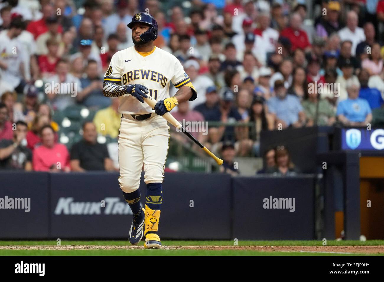 Milwaukee Brewers' Jackson Chourio walks to first base after drawing a ...