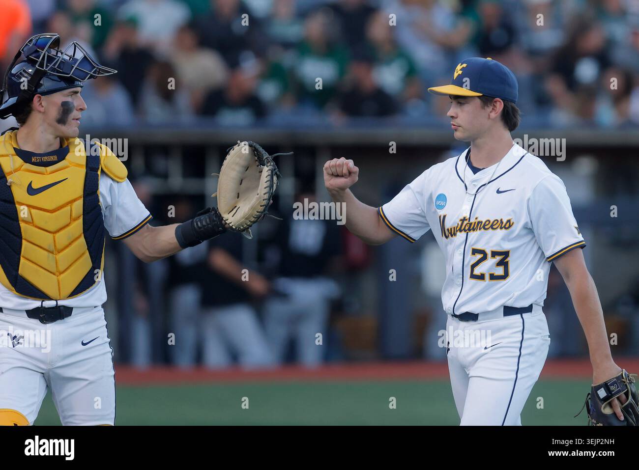 West Virginia catcher Gavin Kelly (2) congratulates pitcher David Hagen ...