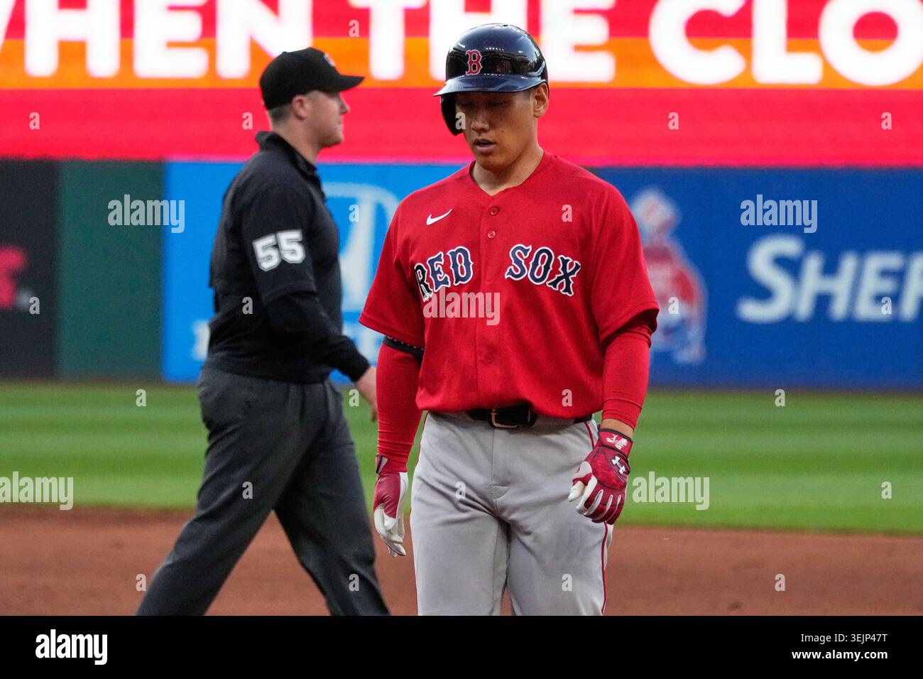 Boston Red Sox's Masataka Yoshida, foreground, walks back to the dugout ...