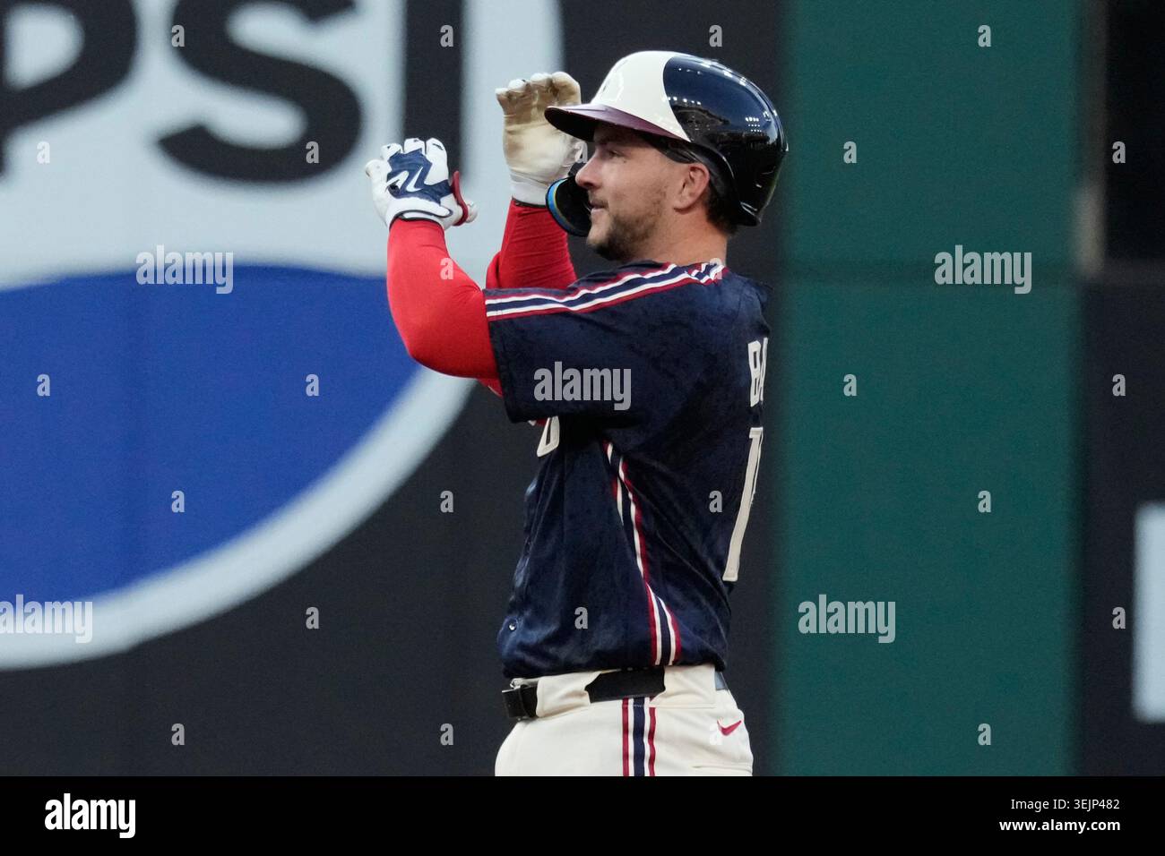 Cleveland Guardians' Patrick Bailey gestures at second base after ...
