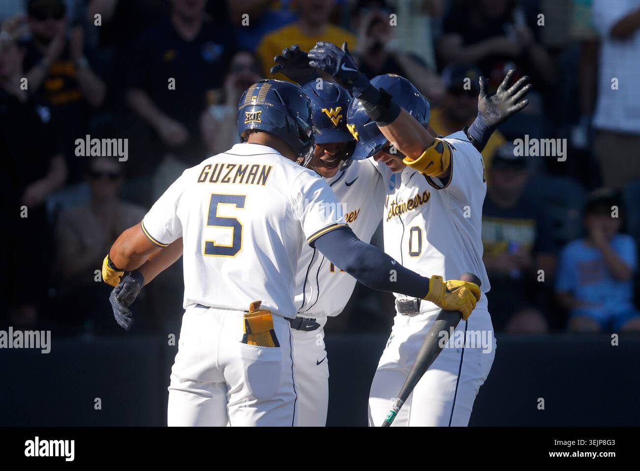 West Virginia utility Matthew Graveline (0) celebrates his home run ...