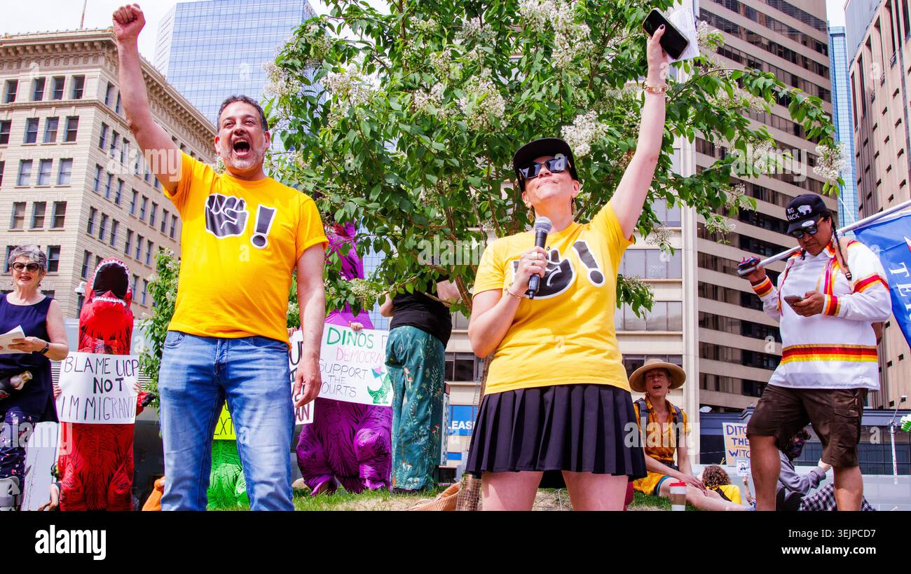 Gil McGowan (L) and Cori Longo (R) sire up the crowd at a demonstration ...