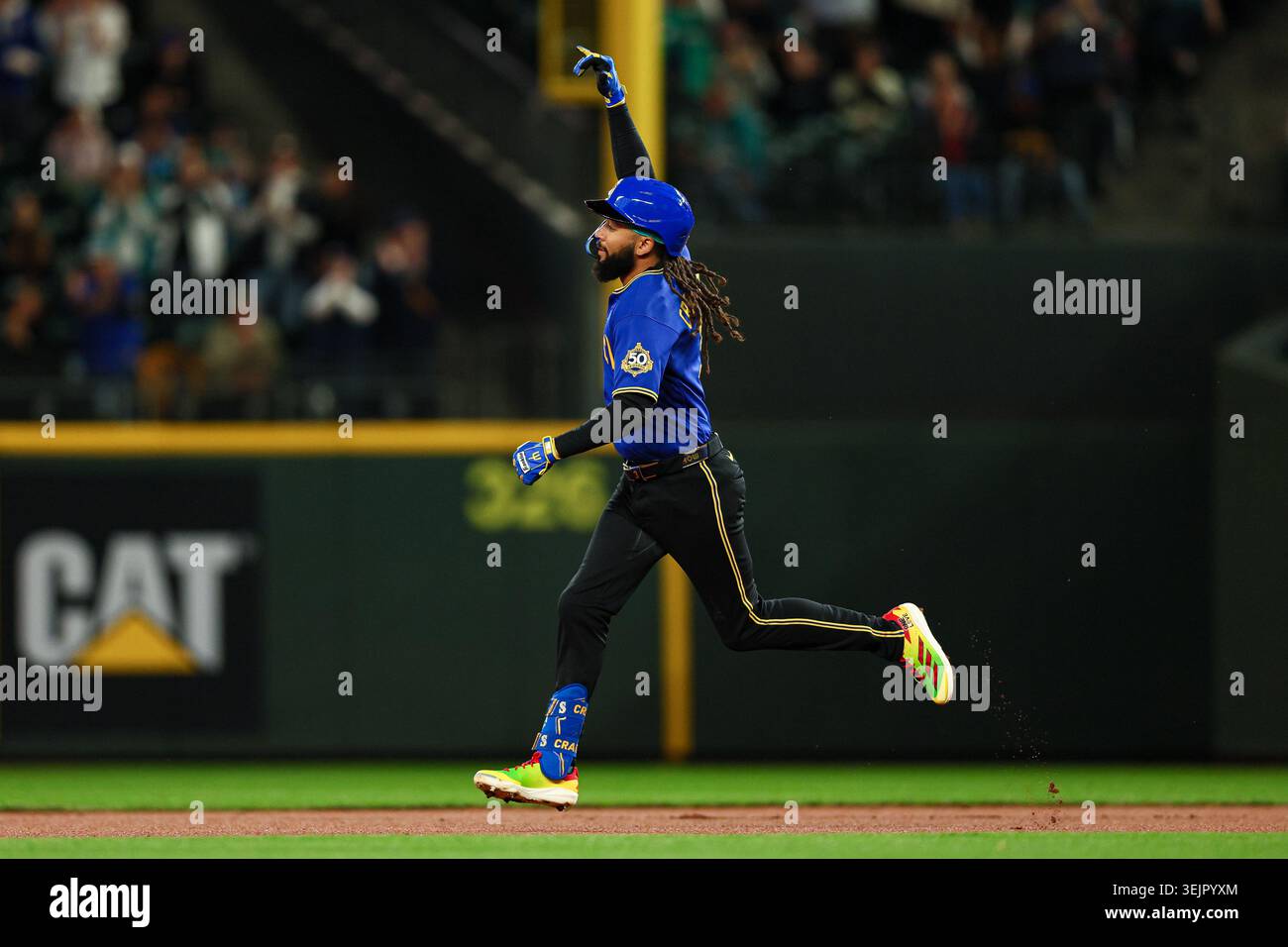 Seattle Mariners' J.P. Crawford gestures as he rounds the bases after ...