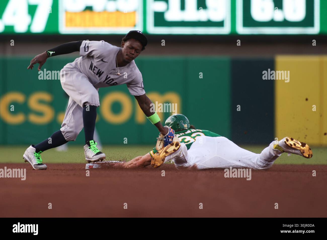 New York Yankees' Jazz Chisholm Jr., left, tags out Athletics Colby ...