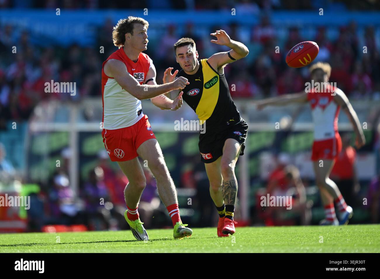 Nick Blakey of the Swans handballs during the AFL Round 12 match ...