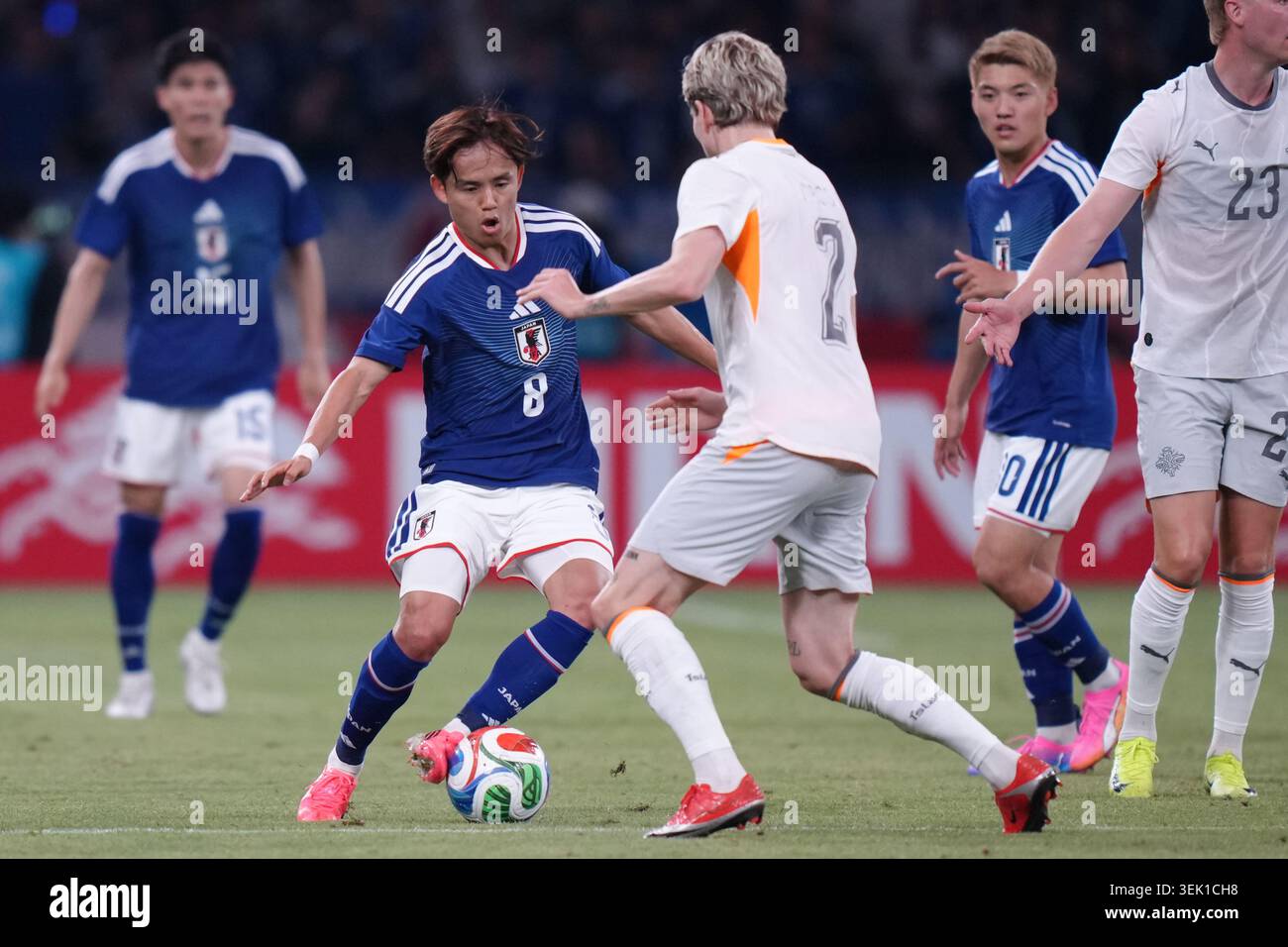 Takefusa Kubo of Japan, left, and Logi Tomasson of Iceland compete for ...