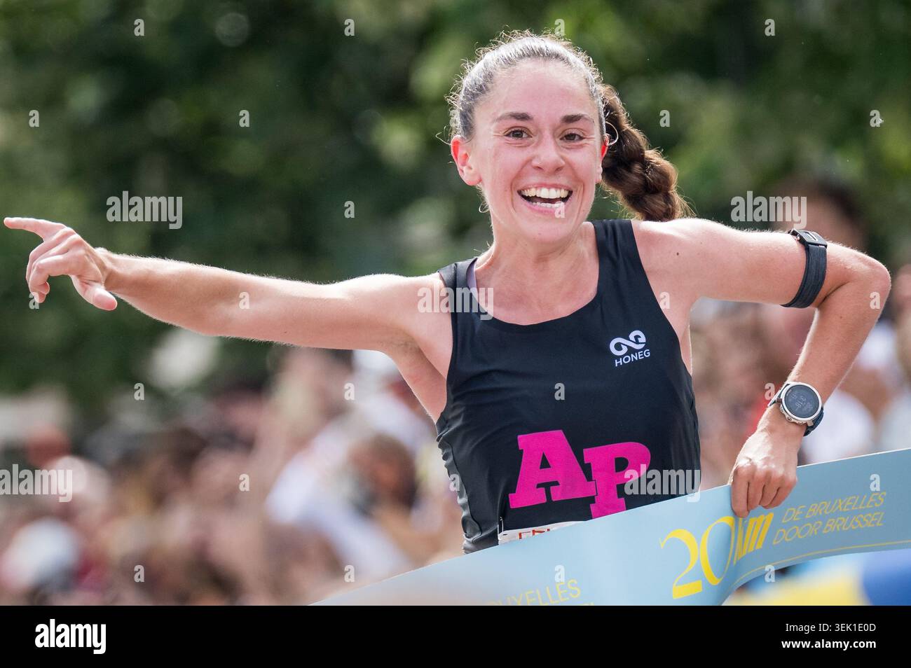 Elisa Vancolen celebrates as she crosses the finish line at the 46th ...