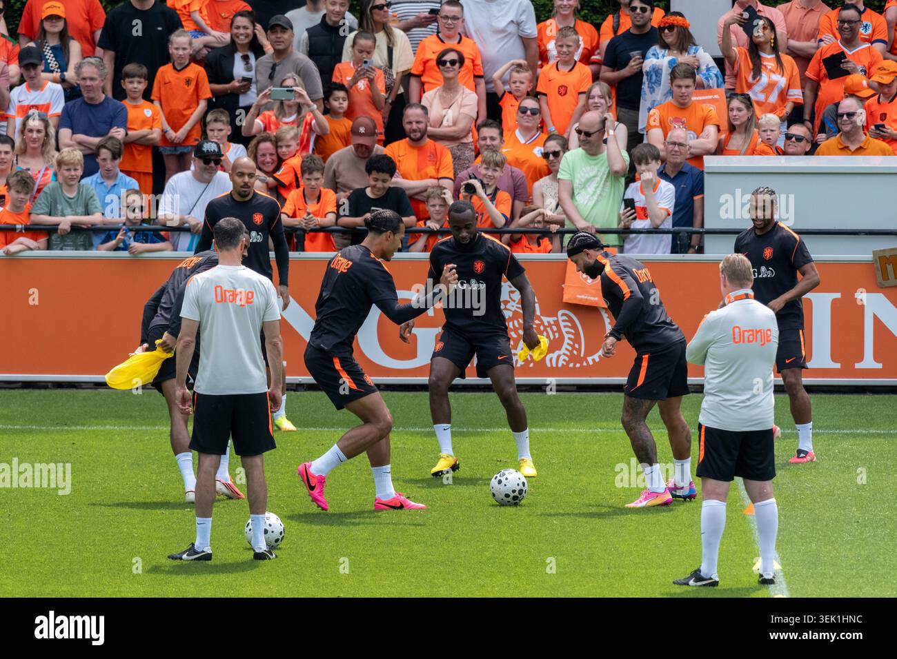 Fans enjoy watching the last practice before the World Cup soccer in ...