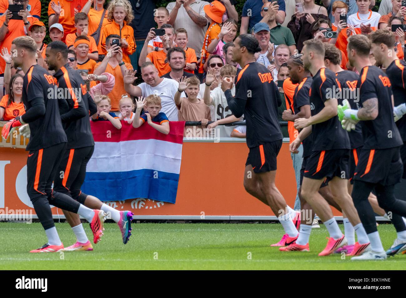 Fans enjoy watching the last practice before the World Cup soccer in ...