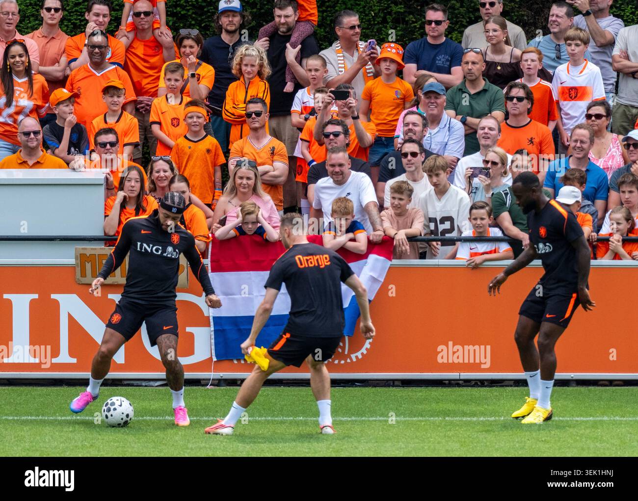 Fans enjoy watching the last practice before the World Cup soccer in ...