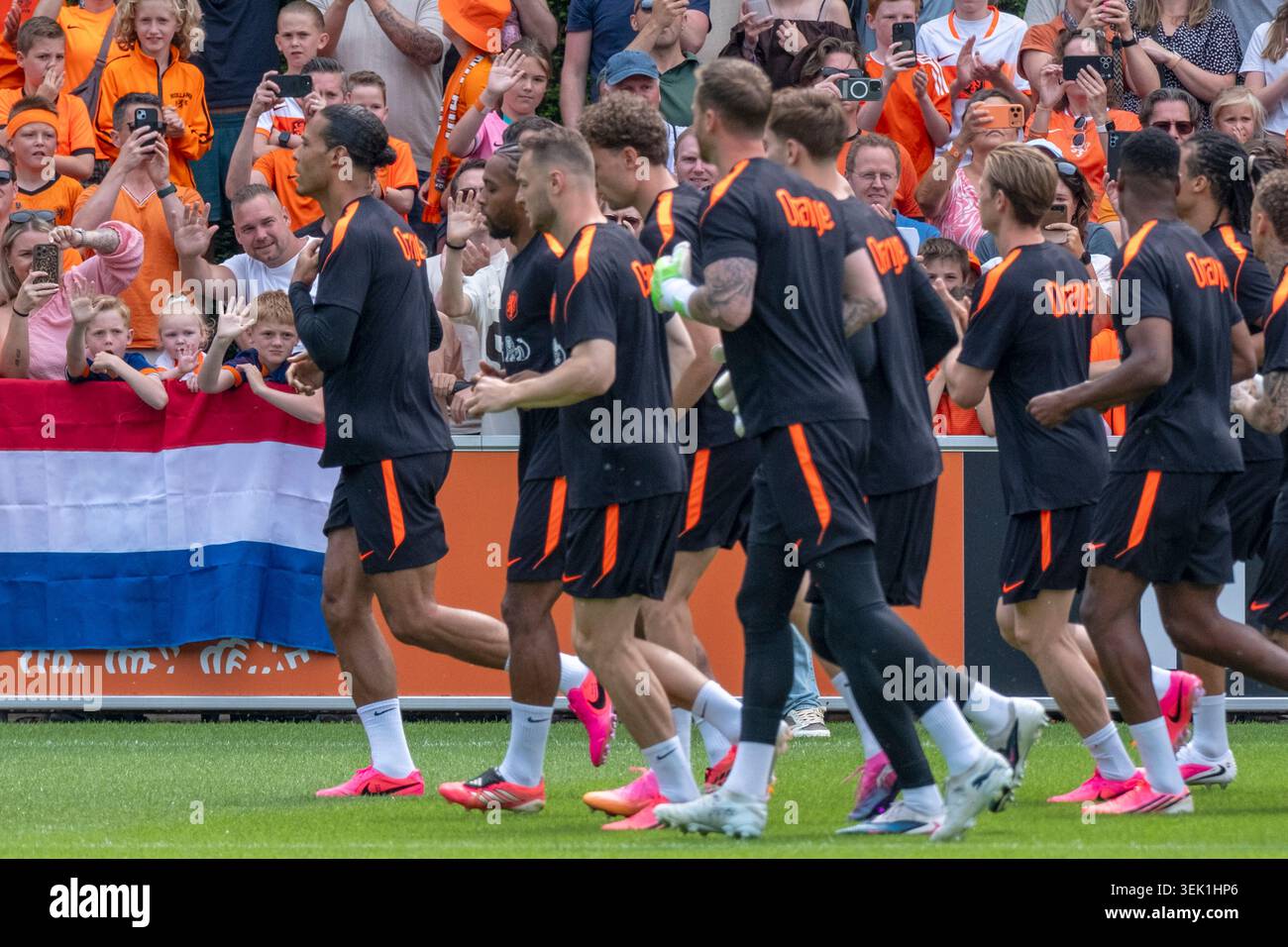 Fans enjoy watching the last practice before the World Cup soccer in ...