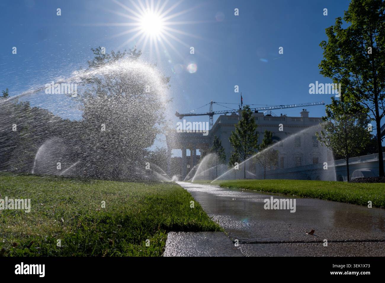 The sprinklers water the lawn of the White House, Sunday, May 31, 2026 ...