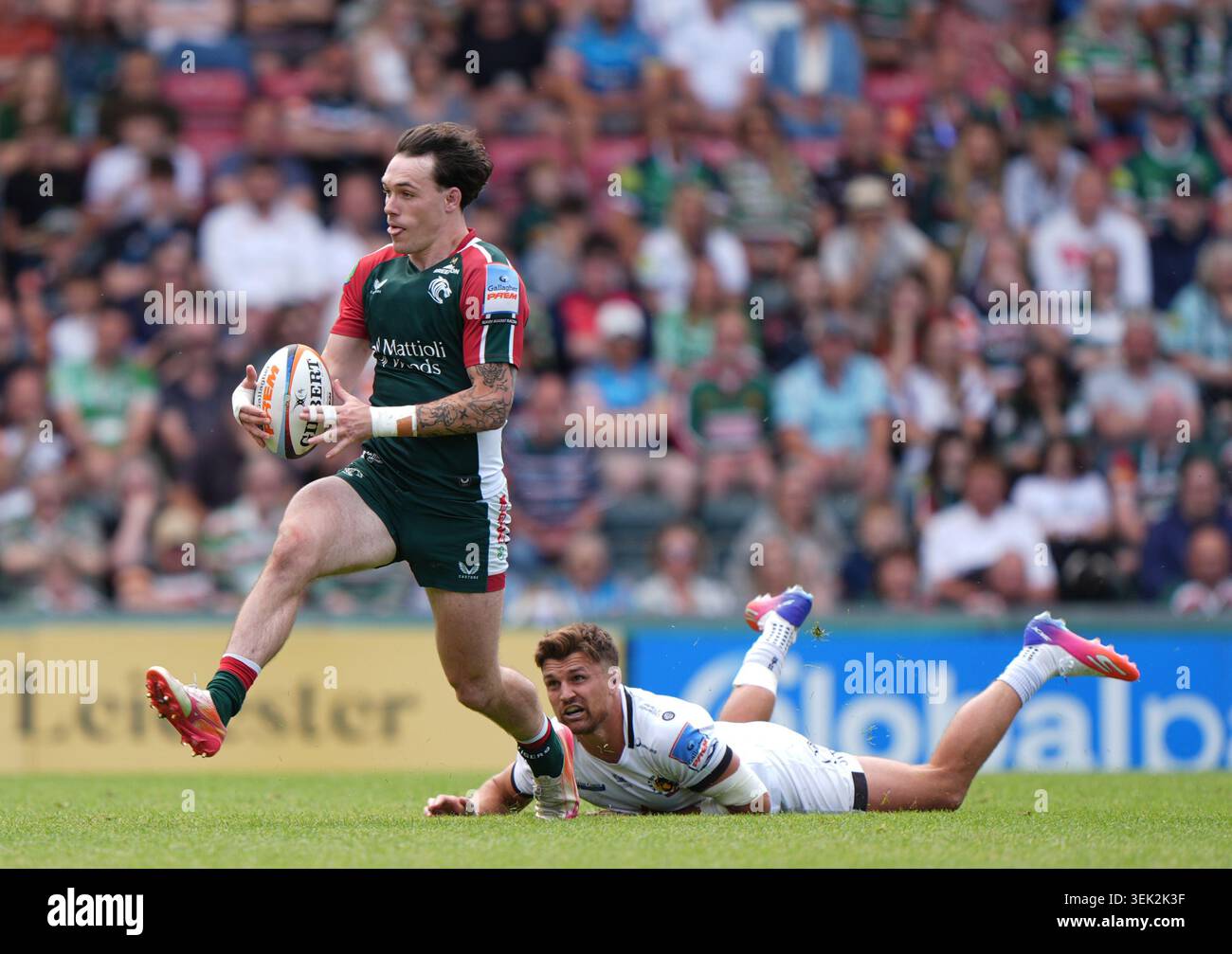 Leicester's Will Wand gets past Exeter's Henry Slade during the ...