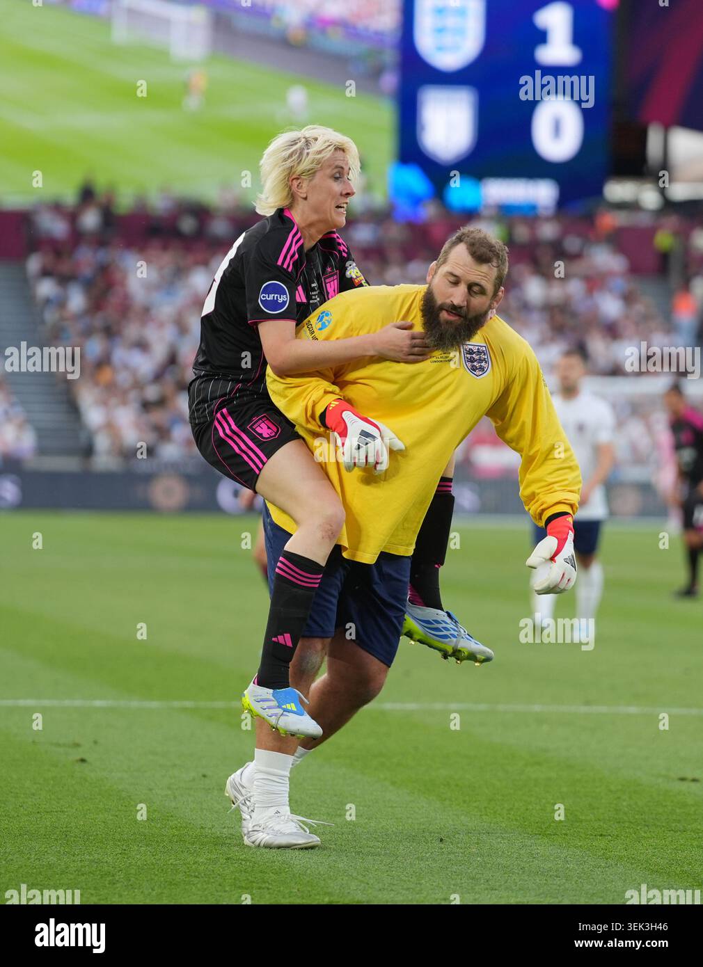 England's Joe Marler and World XI's Maisie Adam during Soccer Aid for ...