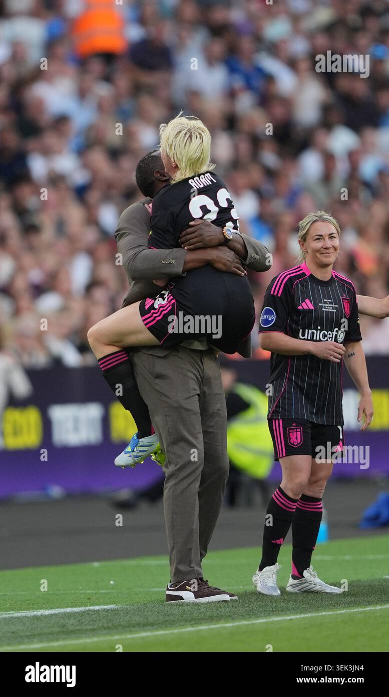 World XI's Maise Adam hugs manager Usain Bolt during Soccer Aid for ...