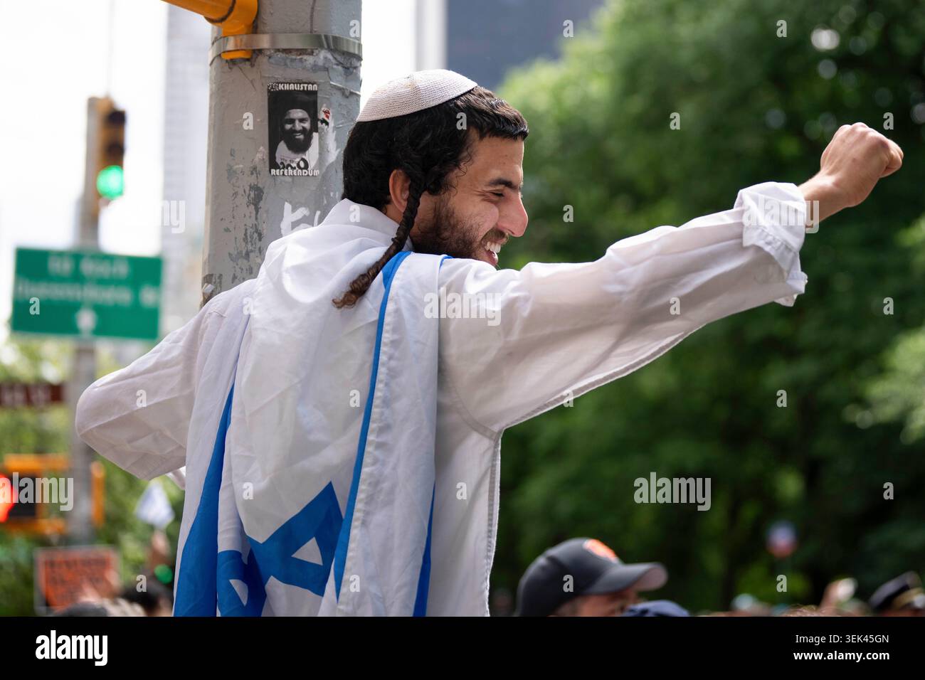 A man pumps his fist during the Israel Day Parade, Sunday, May 31, 2026 ...