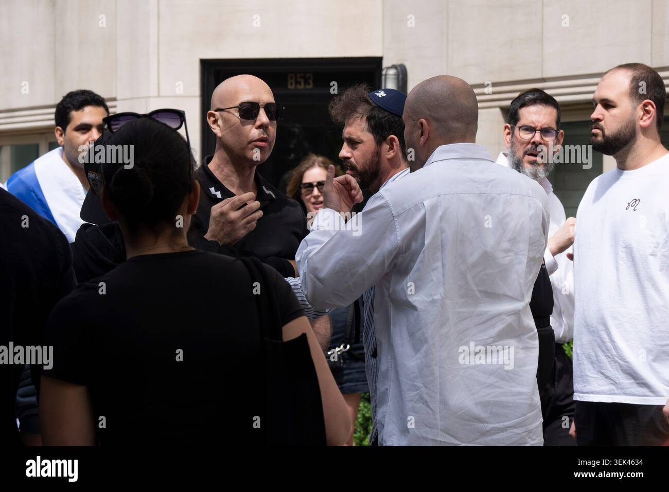 Two spectators get into an argument during the Israel Day Parade ...