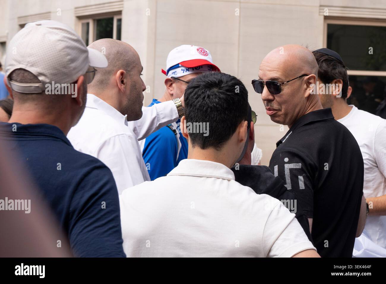 Two spectators get into an argument during the Israel Day Parade ...