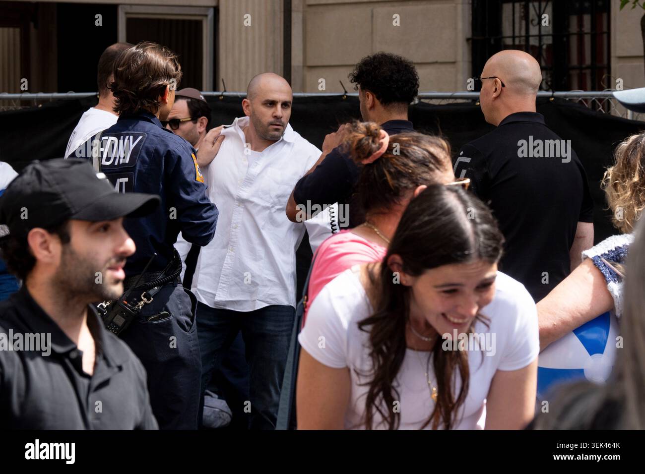 Police separate two spectators as they argue during the Israel Day ...