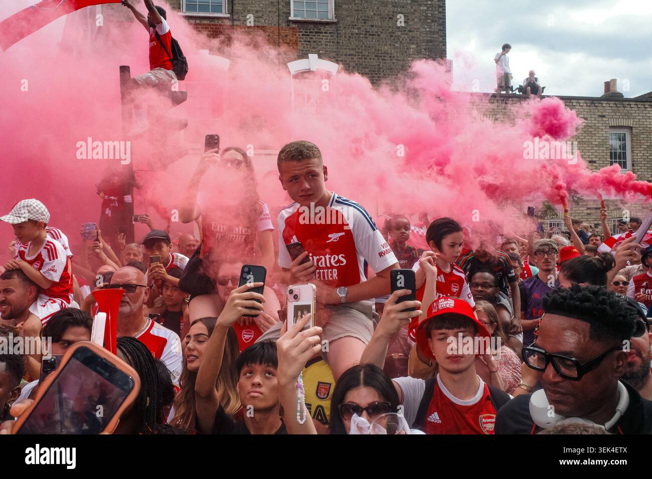 London, UK. 31st May, 2026. Arsenal supporters gather amid red smoke ...