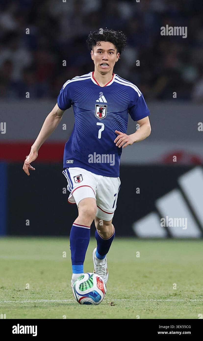 Ao TANAKA of Japan dribbles in the second half of an international ...