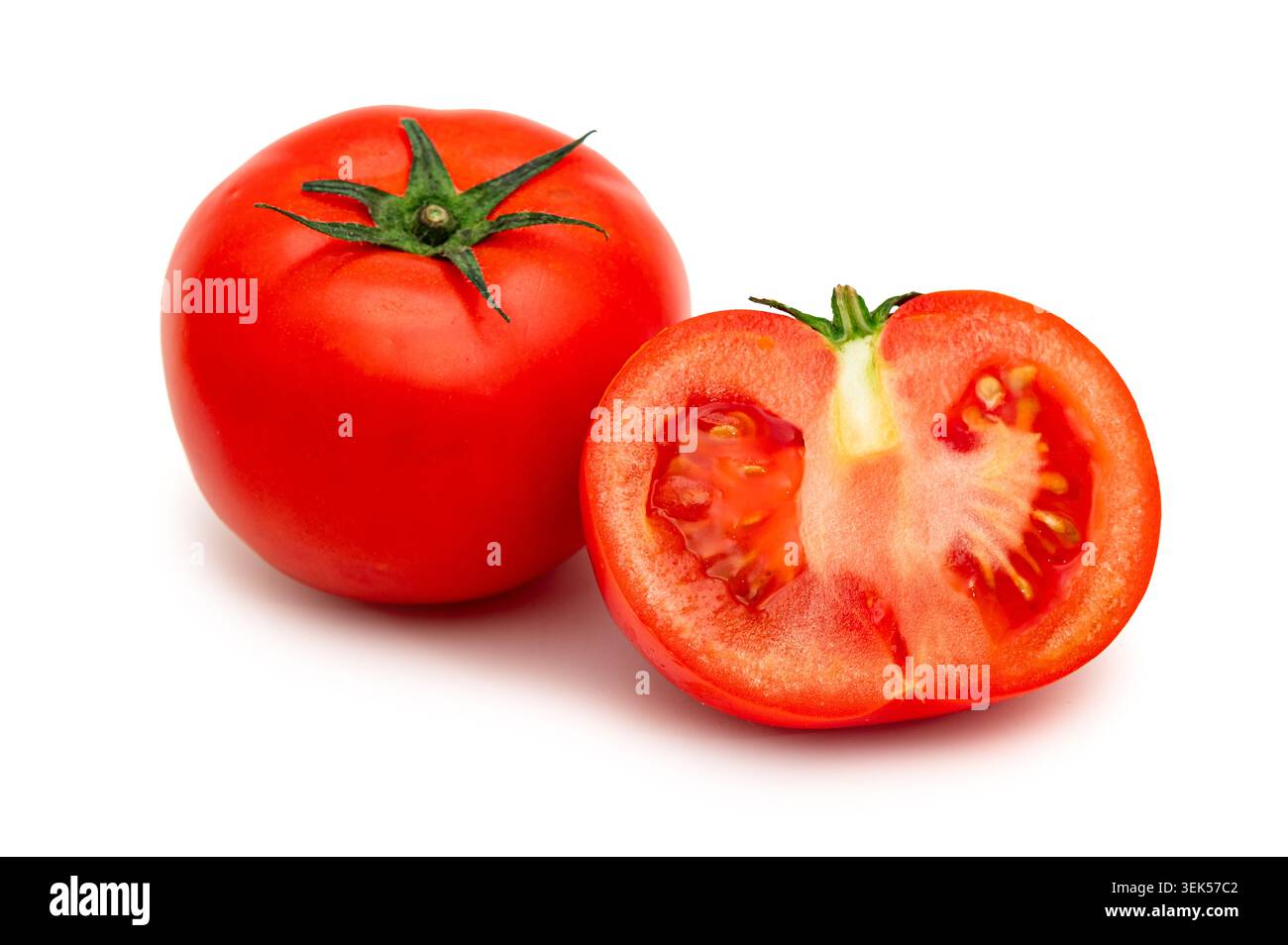 Whole fresh red tomato with a half slice isolated on white background ...