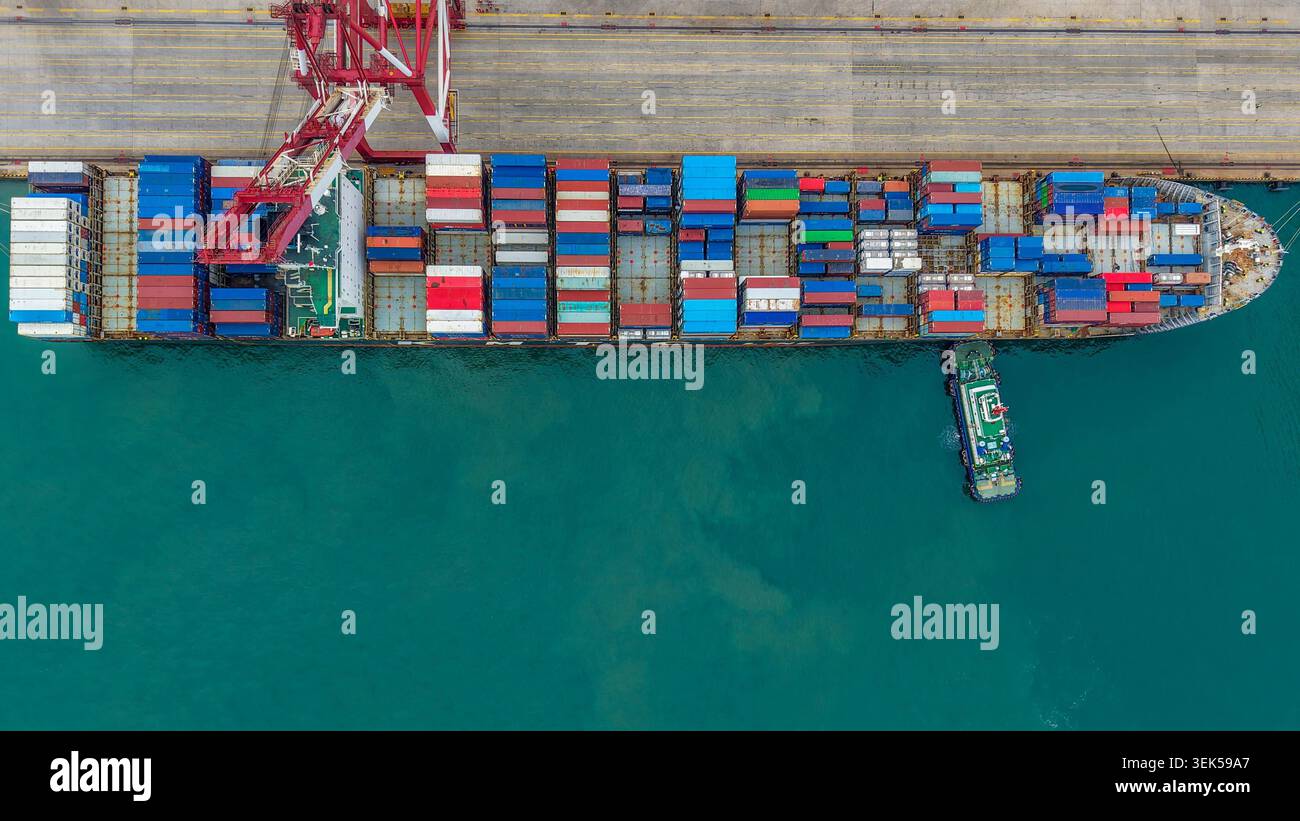 Workers handle cargo at Qingdao Port in east China's Shandong Province ...