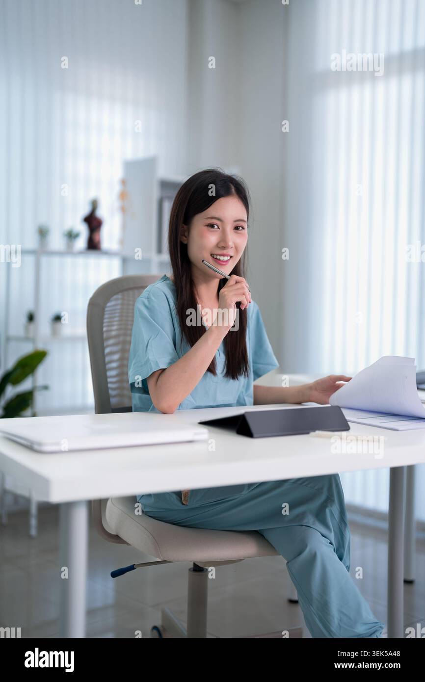 Asian young adult female medical professional in scrubs uniform ...