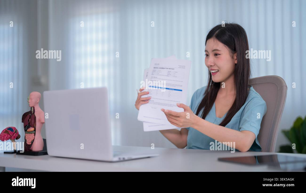Young Asian women doctor presenting medical form document during online ...