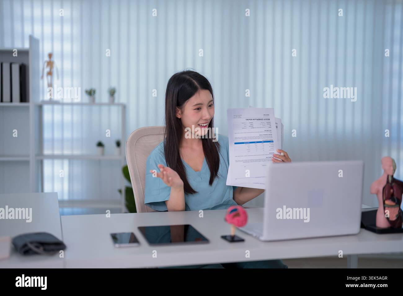 Asian young doctor woman online video call consultation holding medical ...